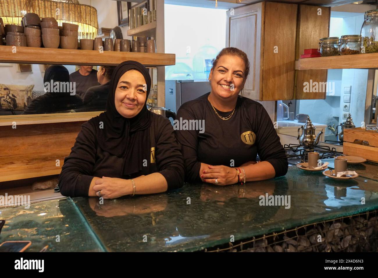 Fes, Morocco. Two lovely Moroccan women working in a coffee shop ...