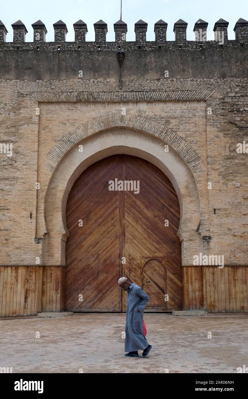 Fes, Morocco. People walking by one of the main gates to the medina ...