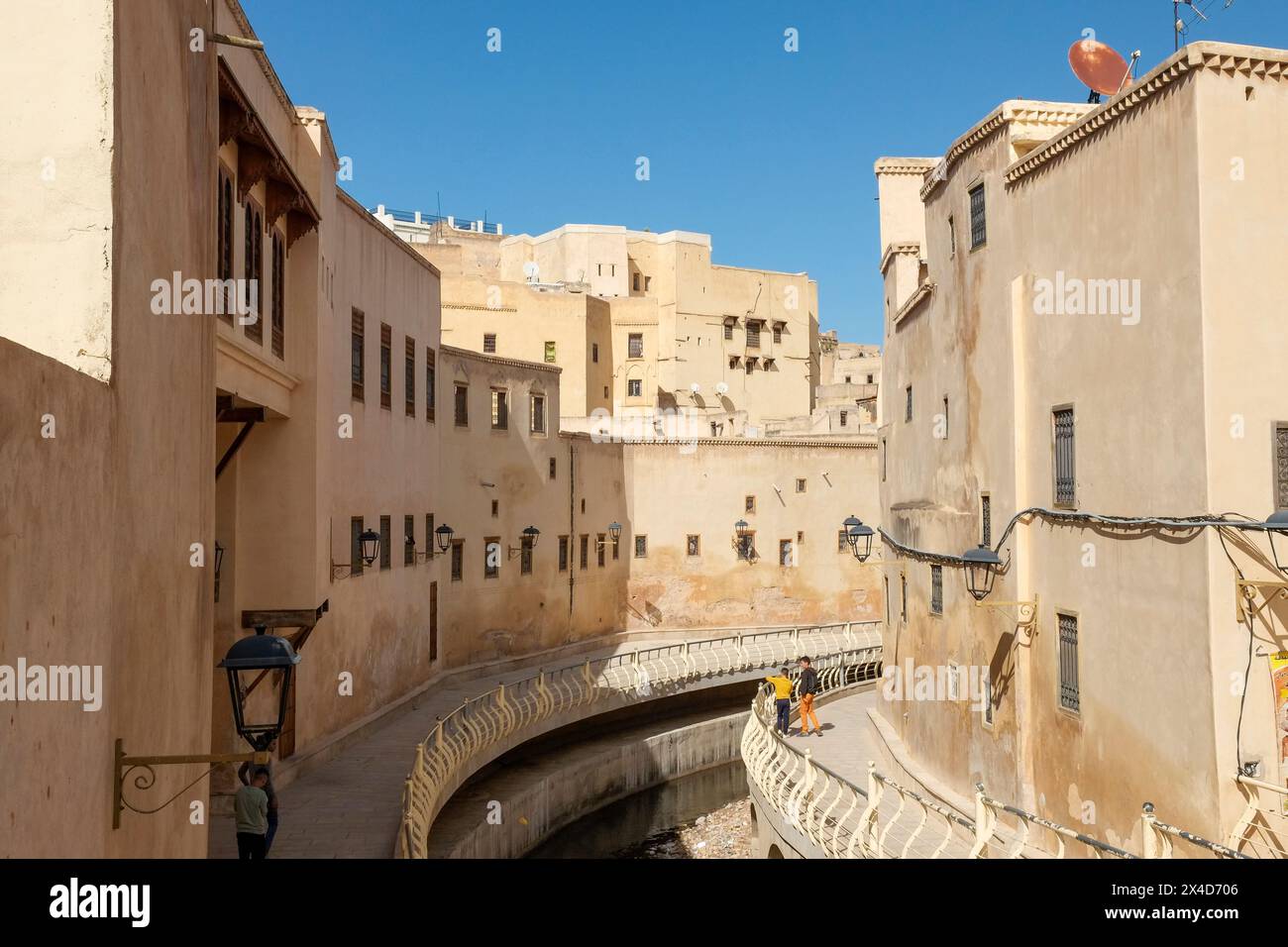 Fes, Morocco. Water way divides the older and newer part of the medina ...