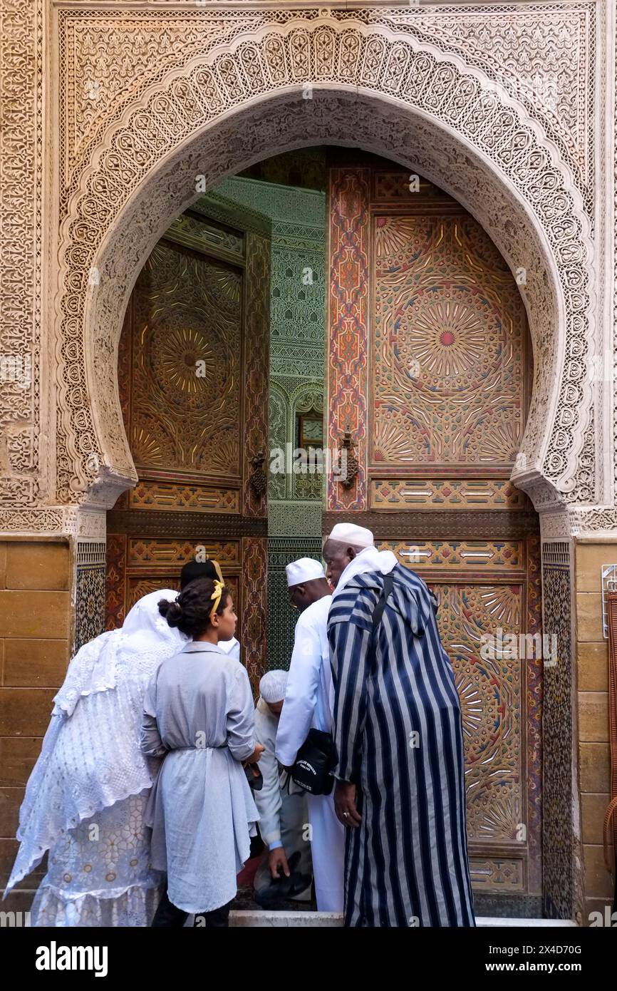 Fes, Morocco. African Muslims entering a specific mosque as part of ...