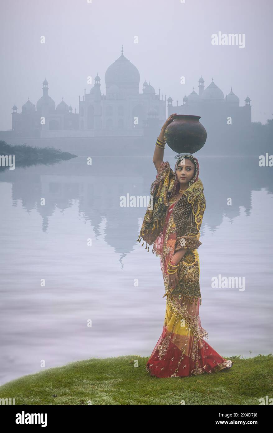 India, Agra. Woman model and Taj Mahal in fog. (Editorial Use Only ...