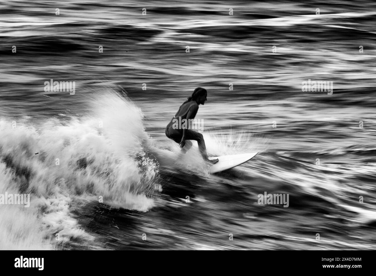Surfing Bali waves along the south coast Indonesia Stock Photo - Alamy
