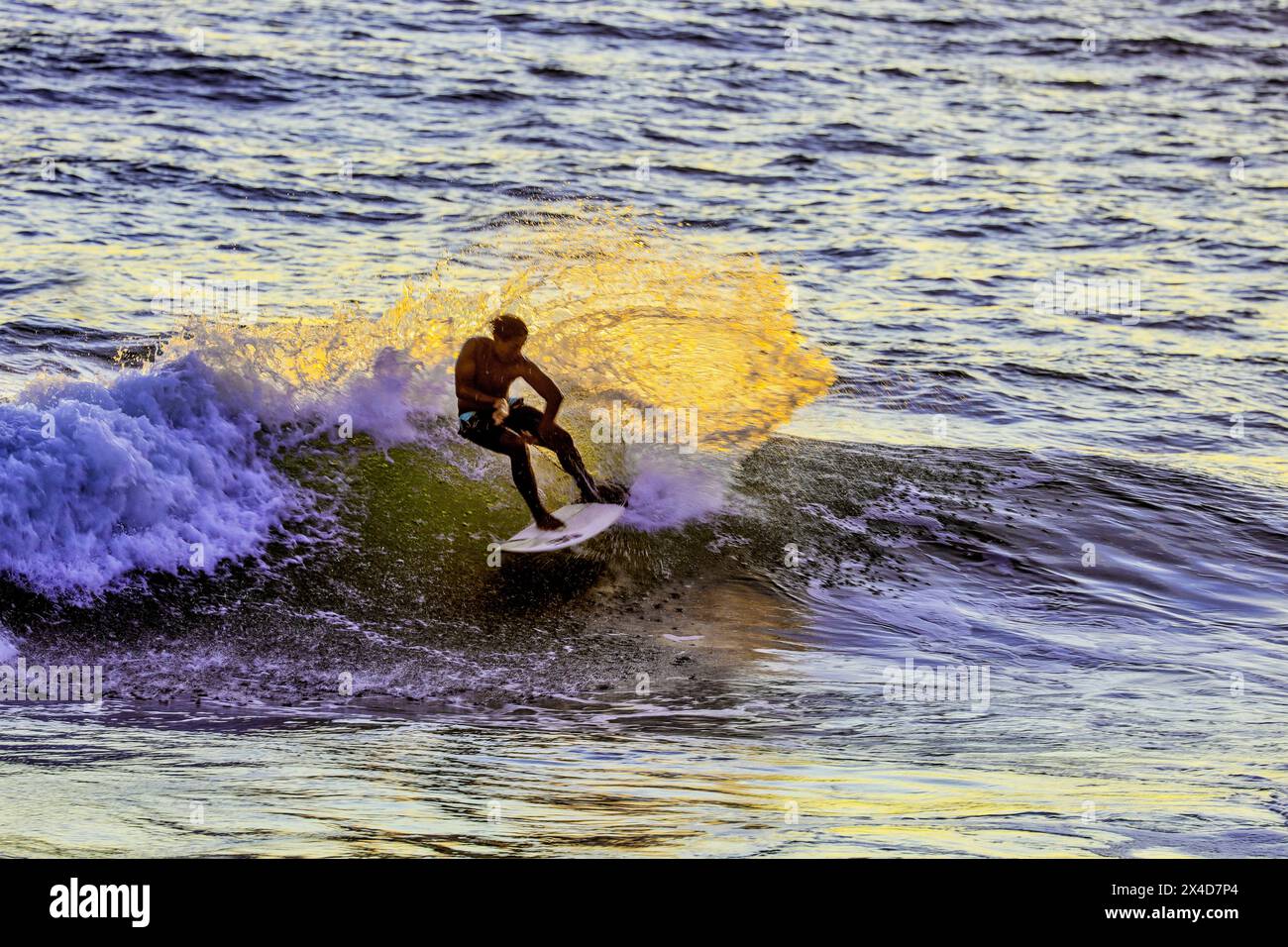 Surfing Bali waves along the south coast Indonesia Stock Photo - Alamy