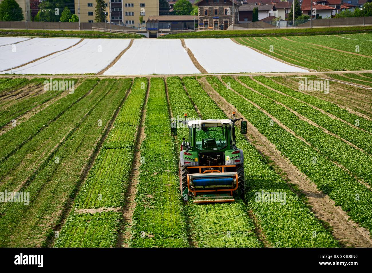 Innsbruck, Austria - May 1, 2024: Tractor with agricultural equipment ...