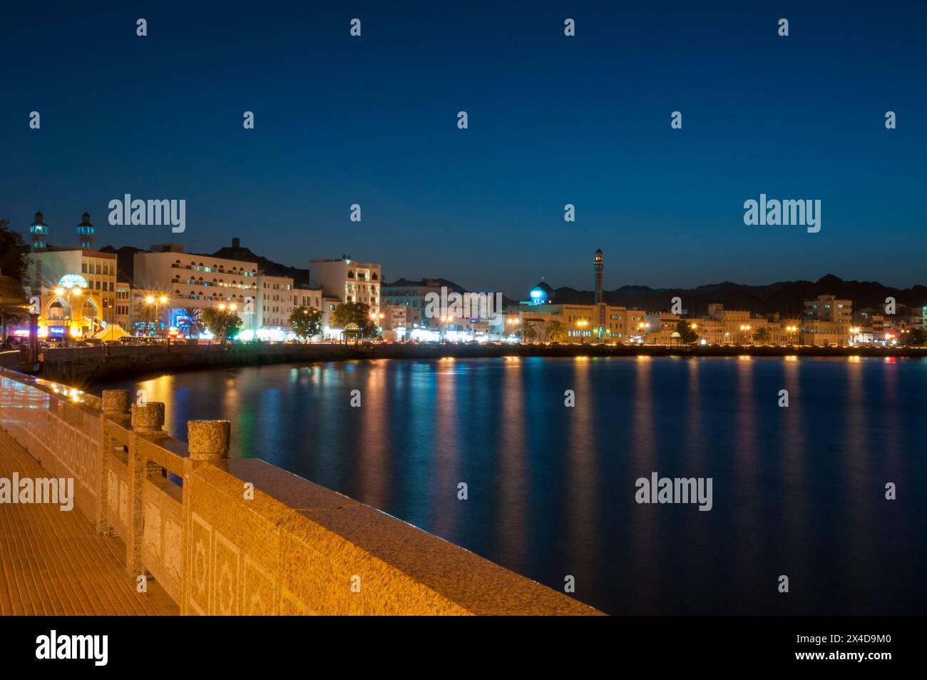 Muttrah corniche at dusk, mountains rising in the distance, the Persian ...