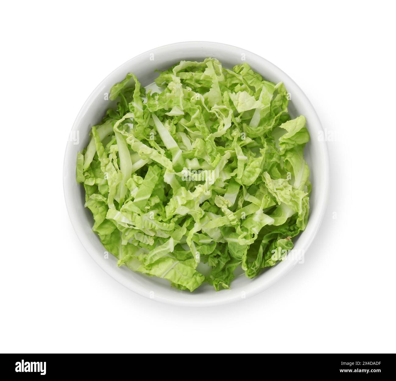 Shredded fresh Chinese cabbage in bowl isolated on white, top view ...