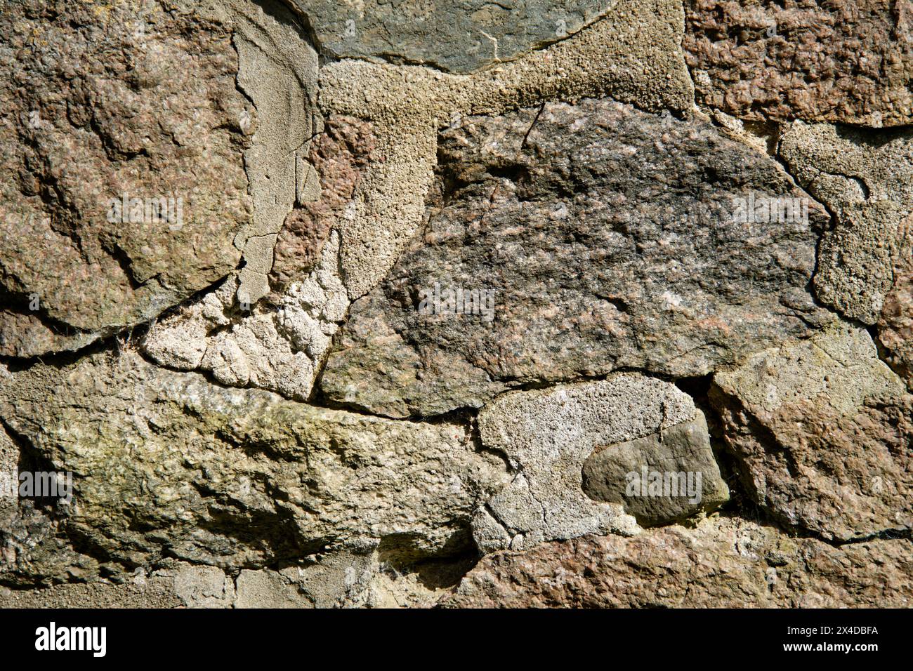 Section of a wall built with natural stones as a background image ...