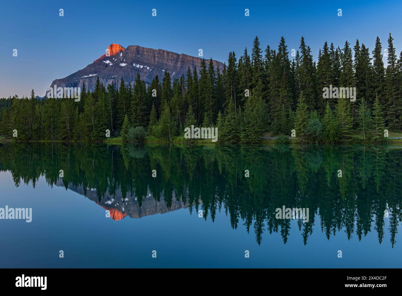 Canada, Alberta, Banff National Park. Mt. Rundle reflected in Cascade ...