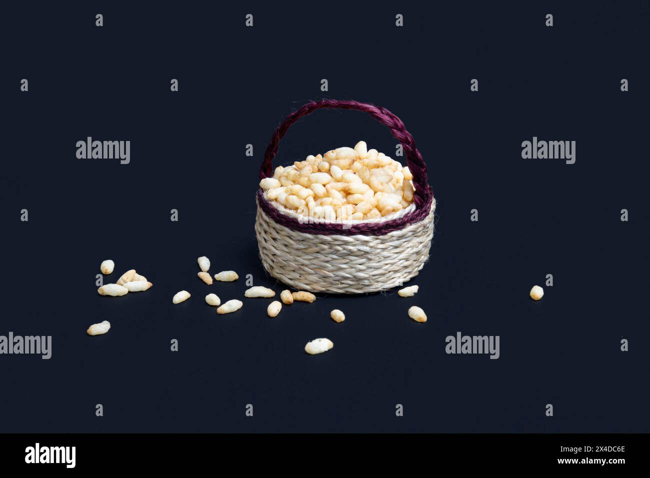 Puffed rice in a jute basket isolated on black background Stock Photo ...