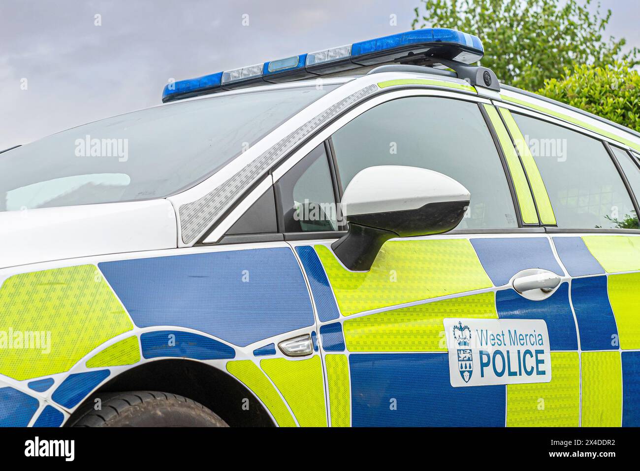 Close up side view of a West Mercia Police car with blue police roof ...