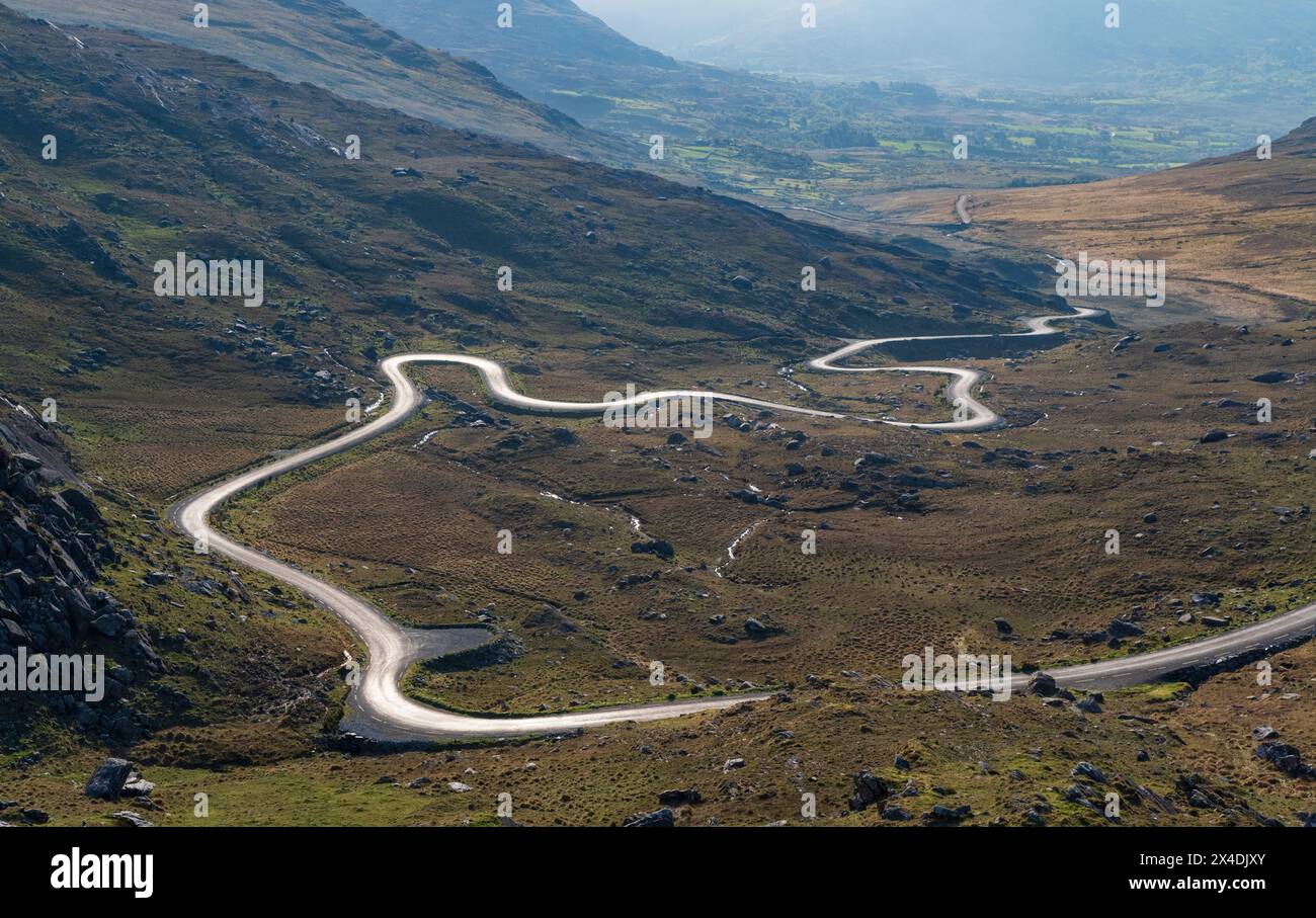 Ireland, Healy Pass. Winding road through hillside landscape Stock ...