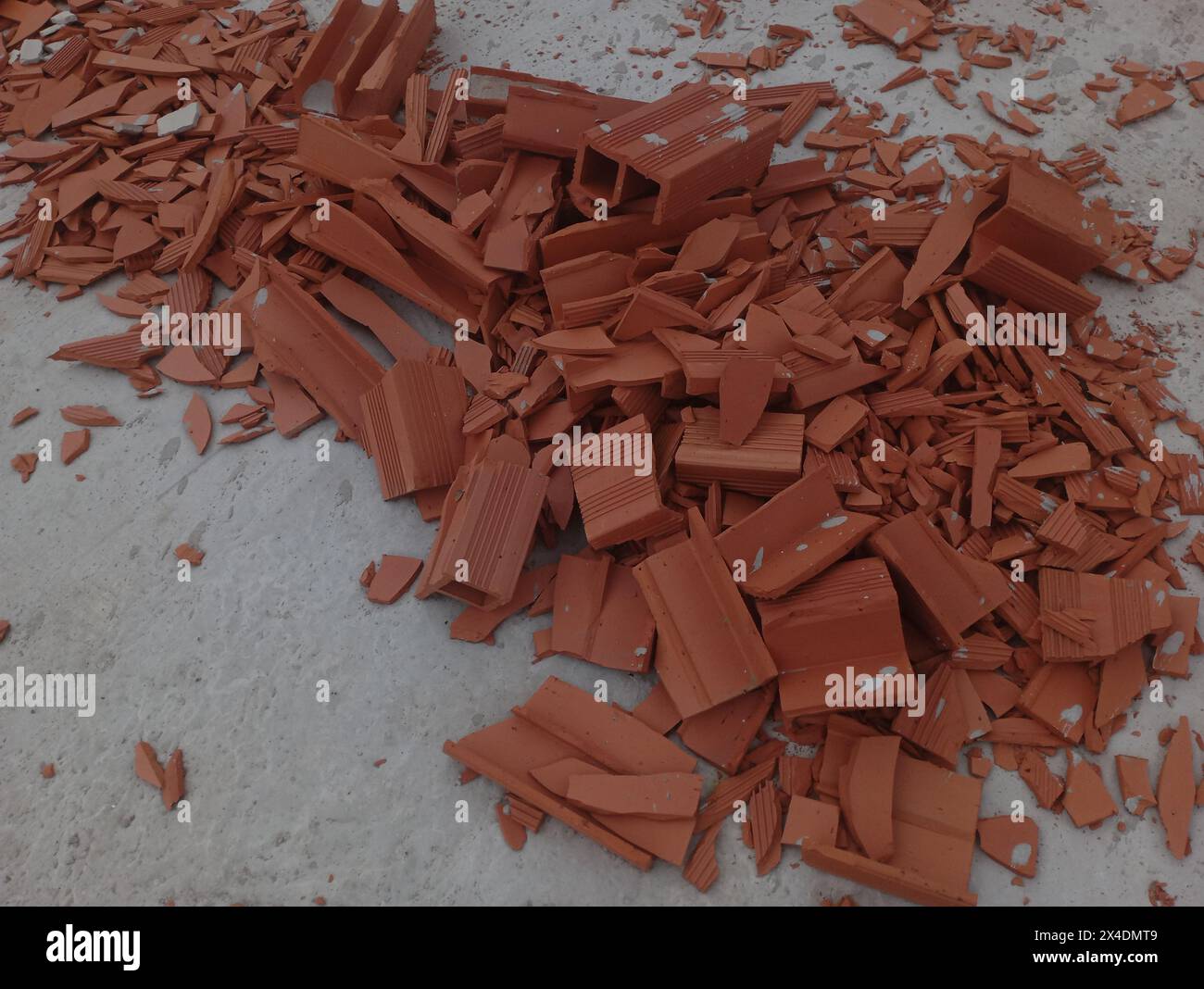 Red brick waste on the floor. Construction waste Stock Photo - Alamy