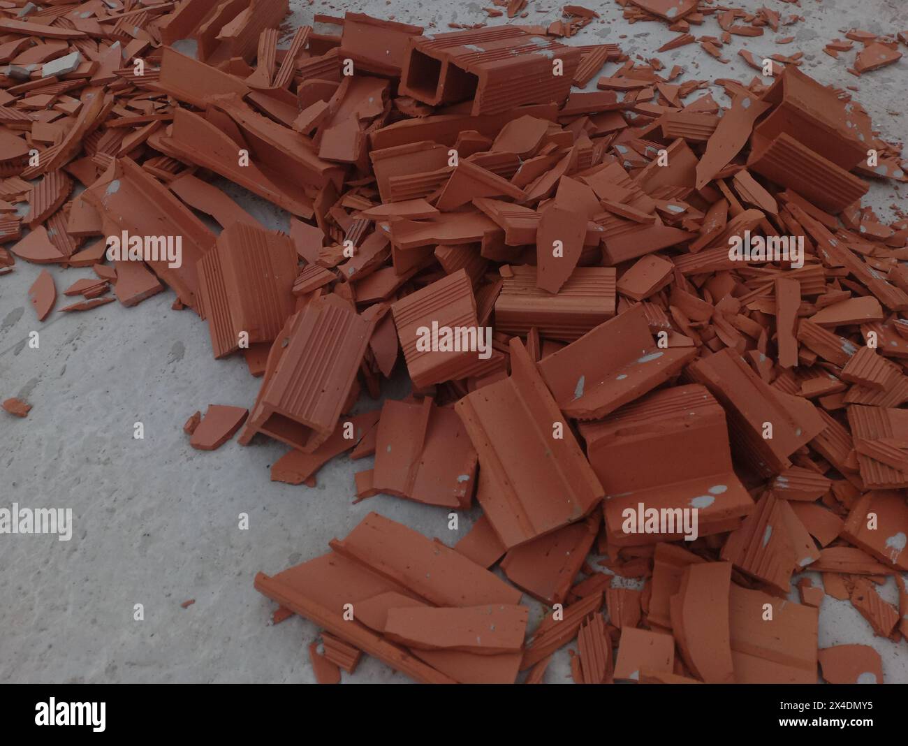 Red brick waste on the floor. Construction waste Stock Photo - Alamy