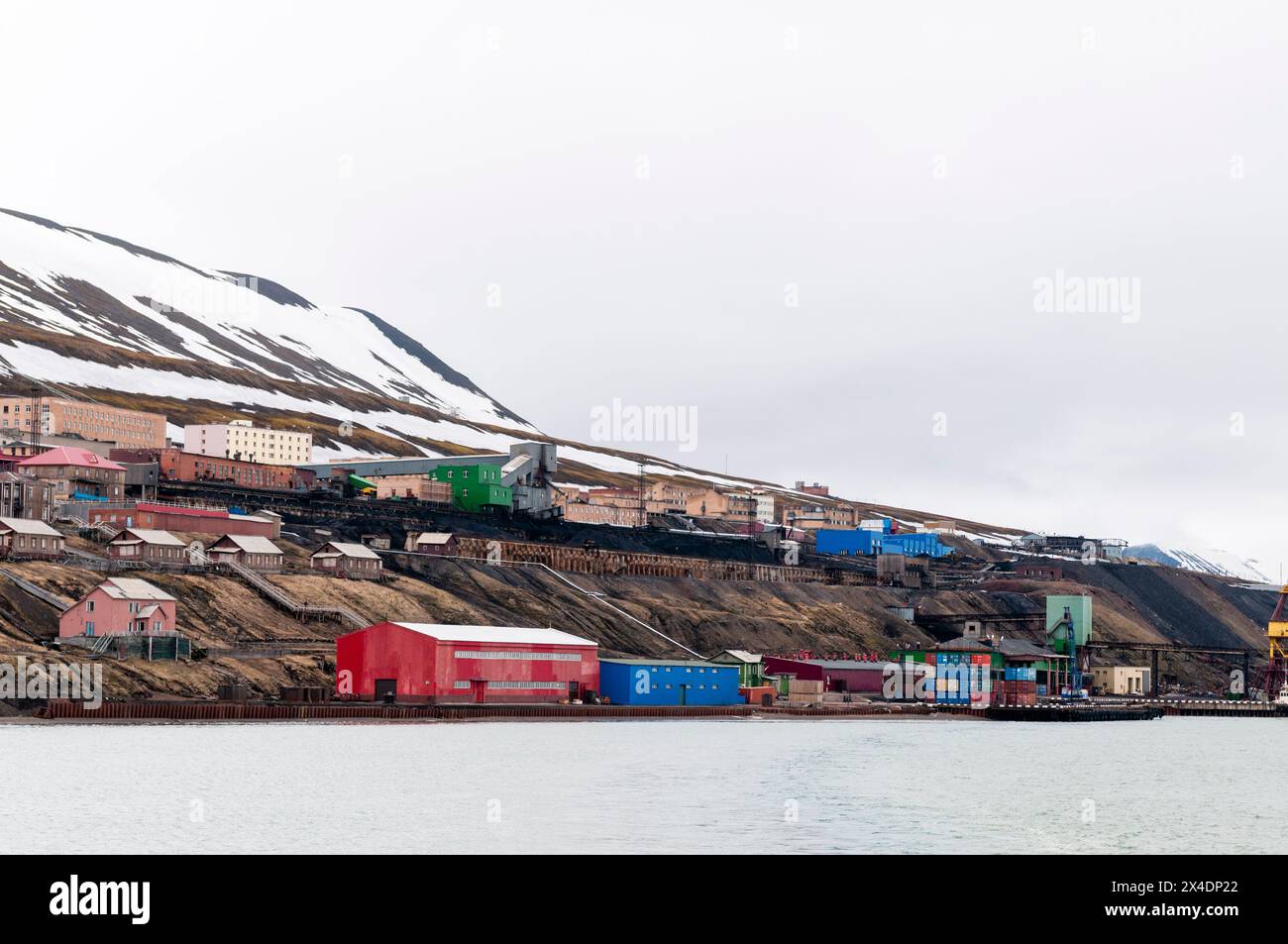 Colorful buildings on the coast of the Russian settlement. Barentsburg ...