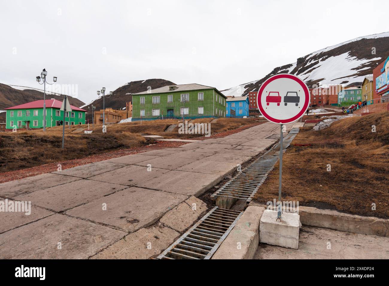 Houses off a concrete road in the Russian settlement of Barentsburg ...
