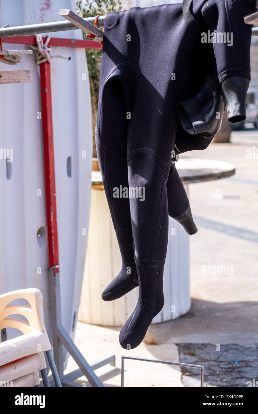 Wetsuit drying hi-res stock photography and images - Alamy