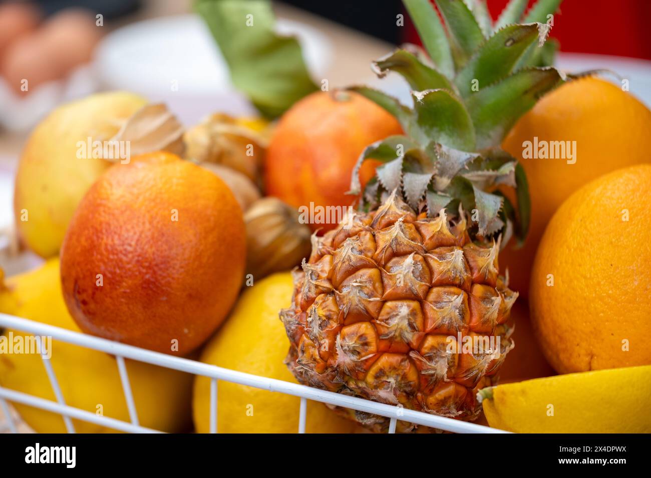 fruits, ripe pineapple, fresh oranges, and yellow bananas, arranged ...