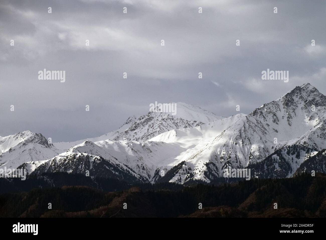 Snow covered mountains in cloudy weather, Tian Shan, large system of ...