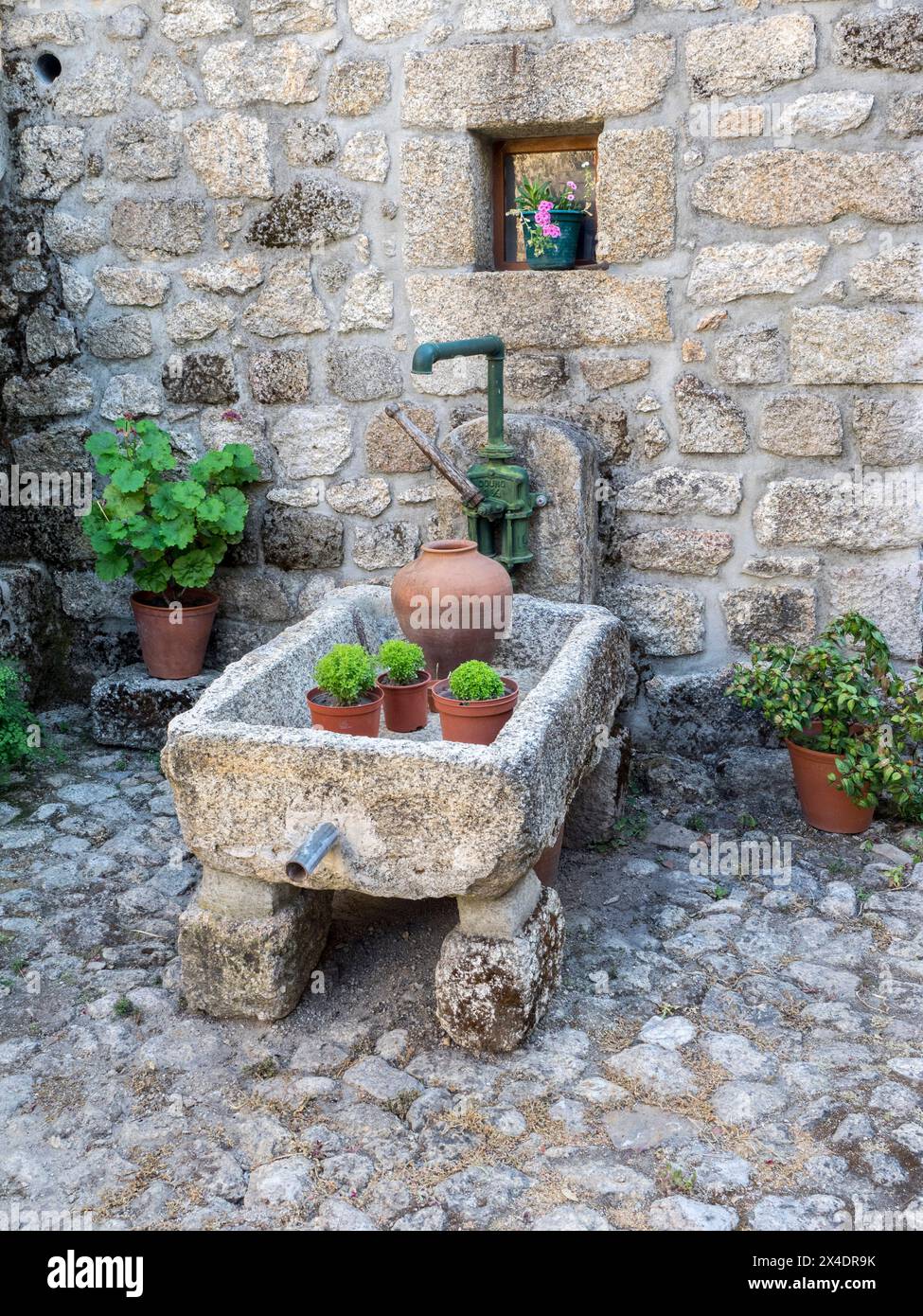 Concrete planter in the Ancient Portuguese village of Monsanto, a ...