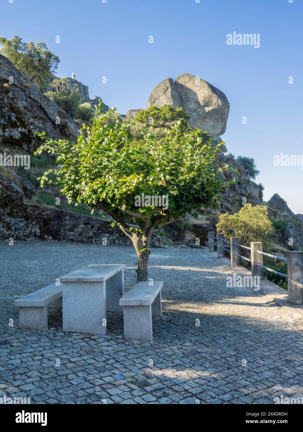 Paved lookout with large boulders above in the ancient, medieval ...