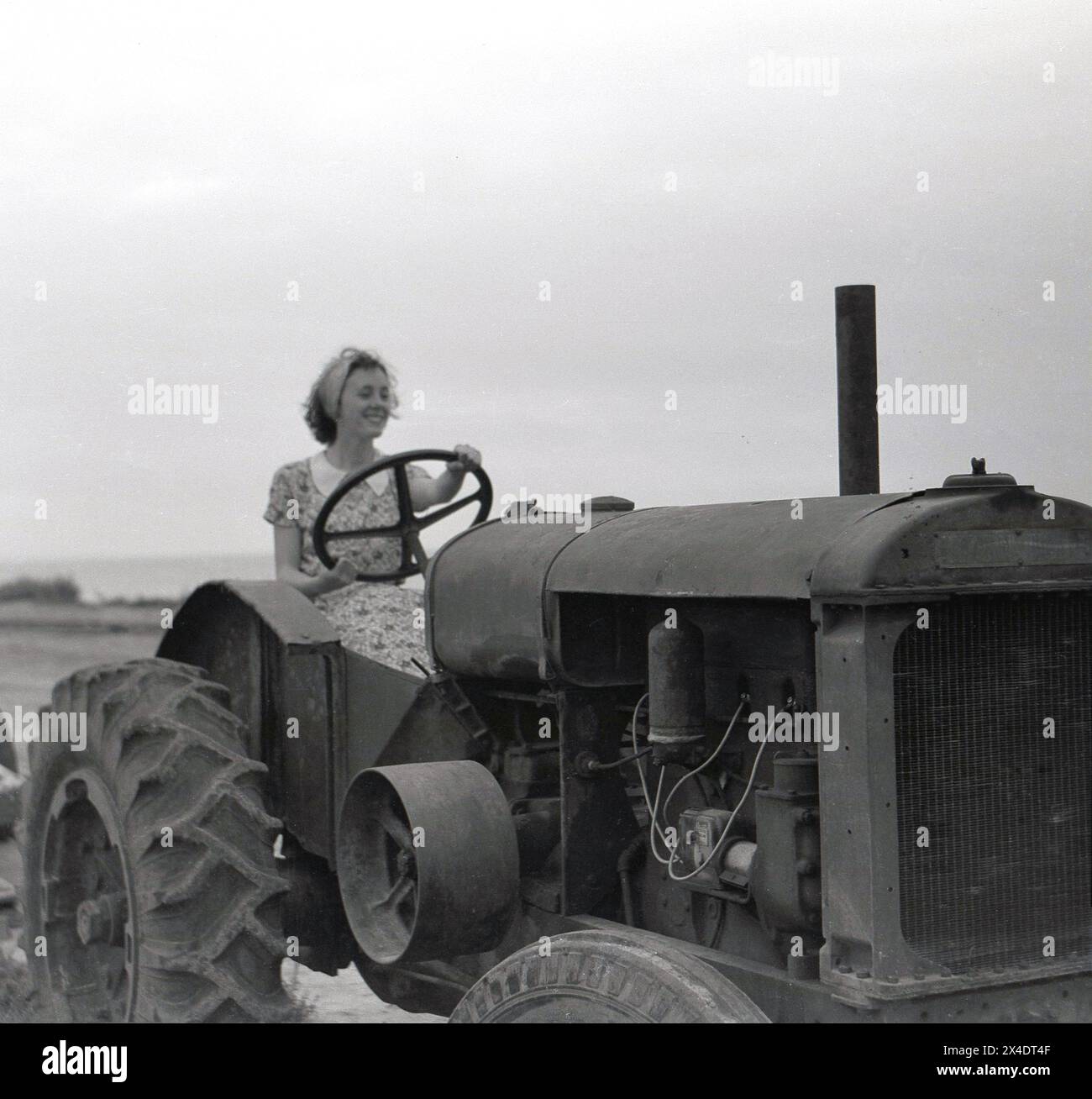 1950s, historical, outside on a beach, a young woman in her mid ...