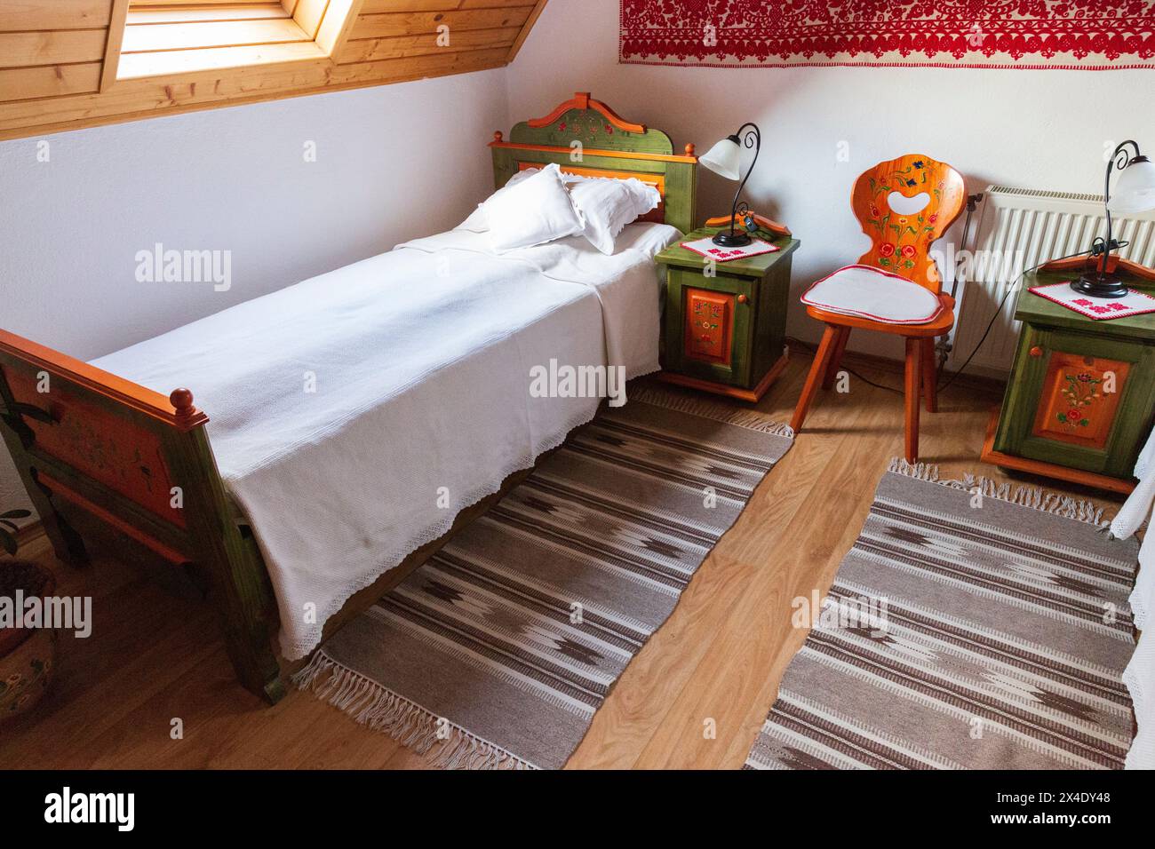 Romania, Transylvania. Traditional hand painted furnishings in a ...