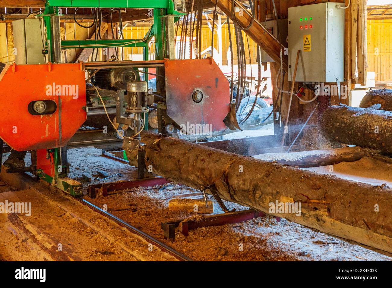 Romania, Transylvania, Suceava. Soft wood sawmill and workers ...