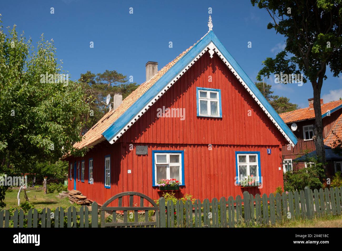 Colourful wooden houses in Nida town on the Curonian Spit in Lithuania ...