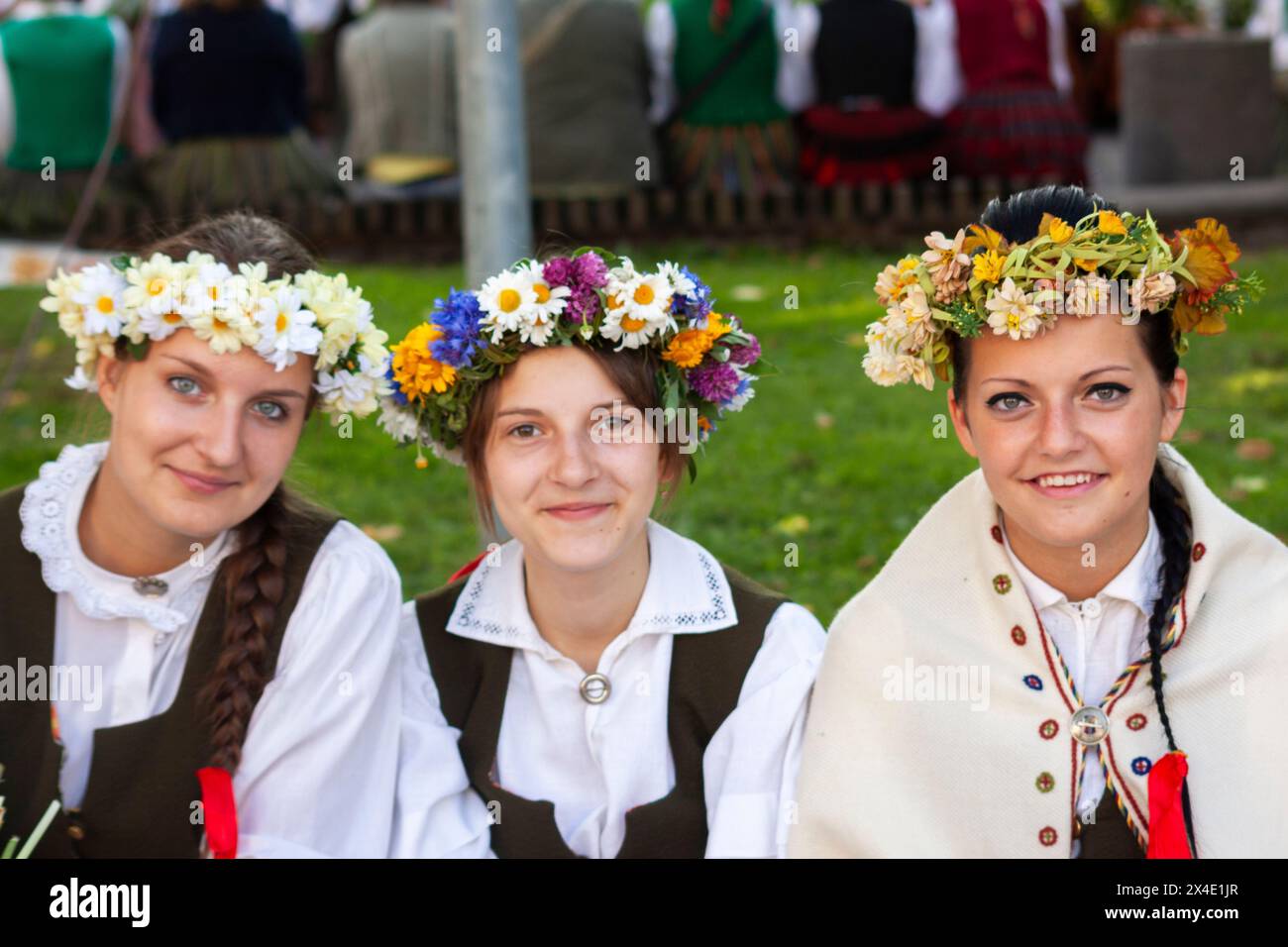 People dressed in traditional floral costume for the mid summer eve ...
