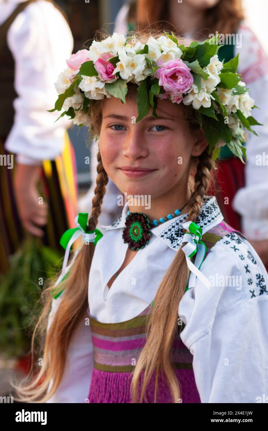 People dressed in traditional floral costume for the mid summer eve ...