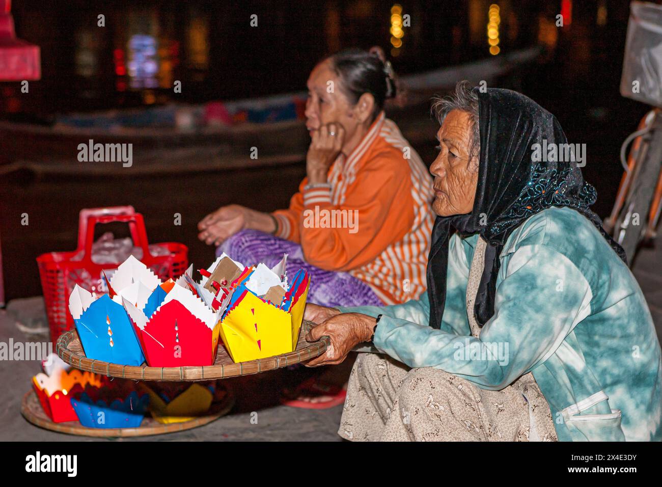 Vietnam, Hoi An, Famous lanterns, aged woman selling small floating ...