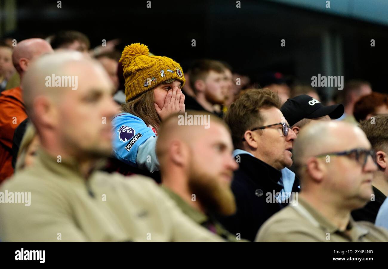 An Aston Villa fan appears dejected after their side concedes a second ...