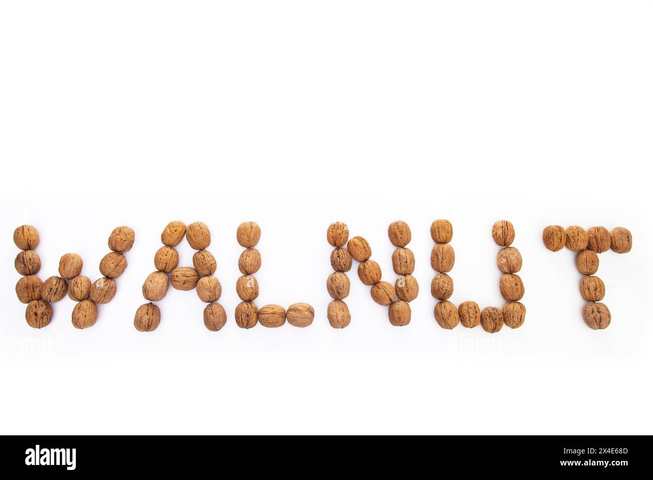 Walnut lettering from walnuts on a white background Stock Photo - Alamy