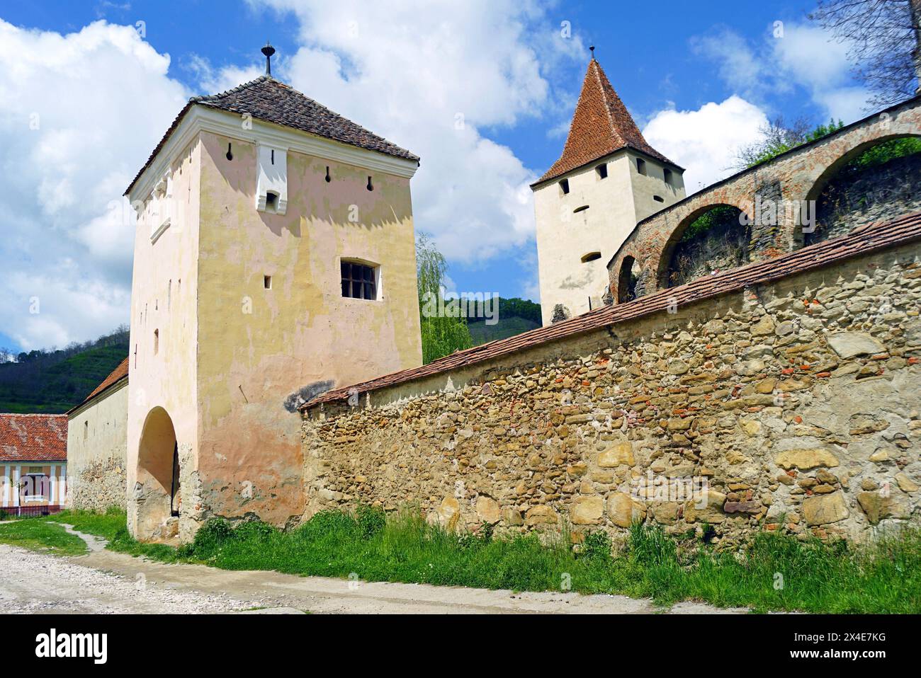 Defensive walls and two towers built on different levels of the ...