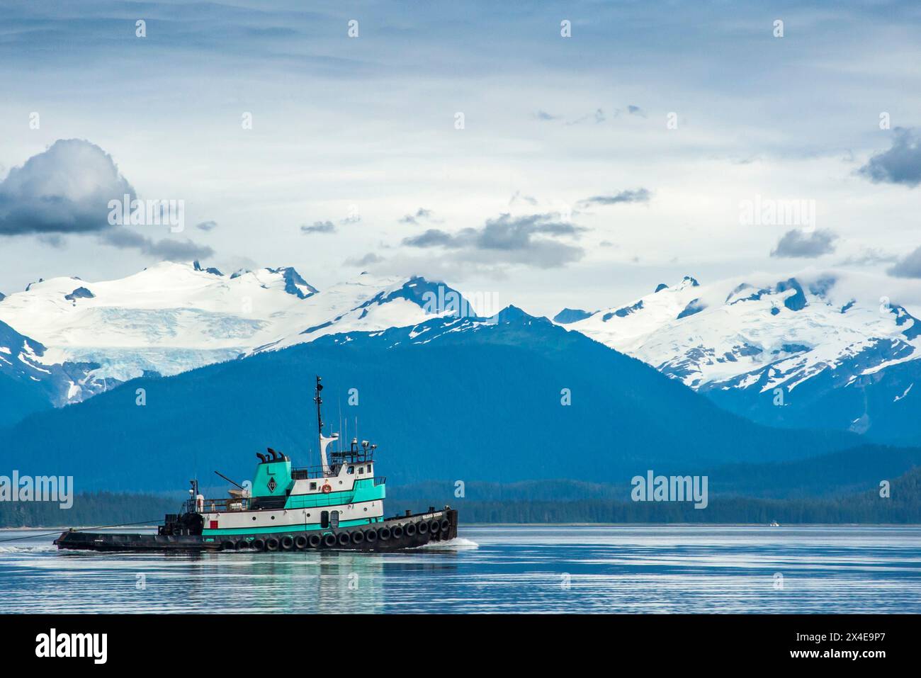 USA, Alaska, Tongass National Forest. Fishing boat moves through ocean ...