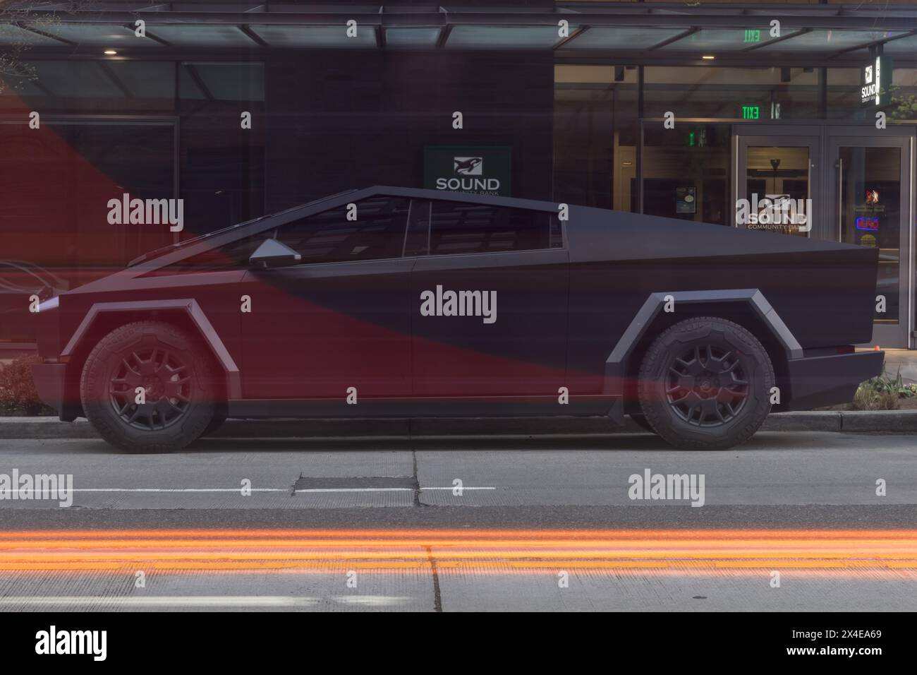 Seattle, USA. 15 Apr, 2024. A parked matte black wrapped Tesla ...