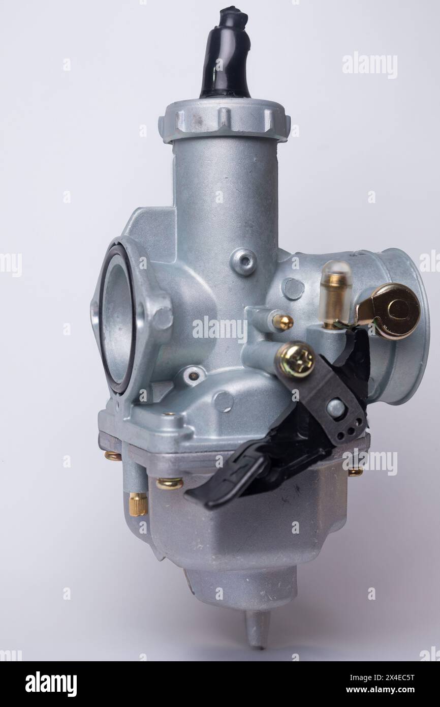 new carburetor for moped isolated on white Stock Photo - Alamy