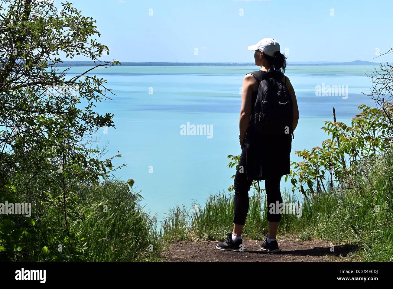Woman hiking and admiring view of lake Balaton from Tihany peninsula in summer Stock Photo - Alamy