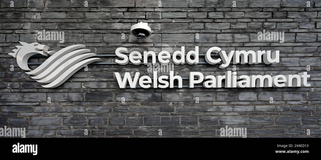 Cardiff Bay Sign on grey slate wall for Welsh Parliament - Senedd Cymru ...