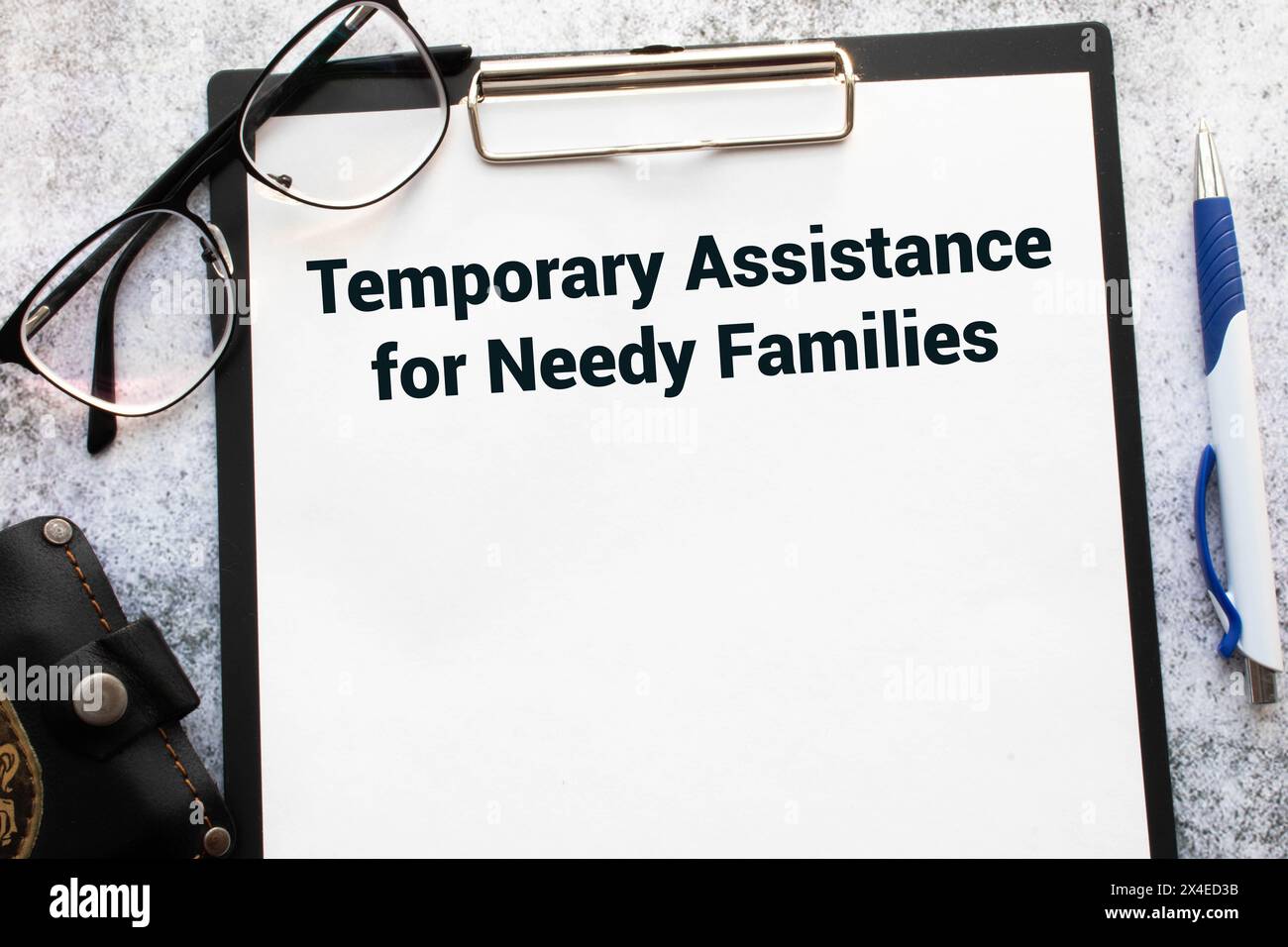 Temporary Assistance for Needy Families TANF is shown on a photo using ...