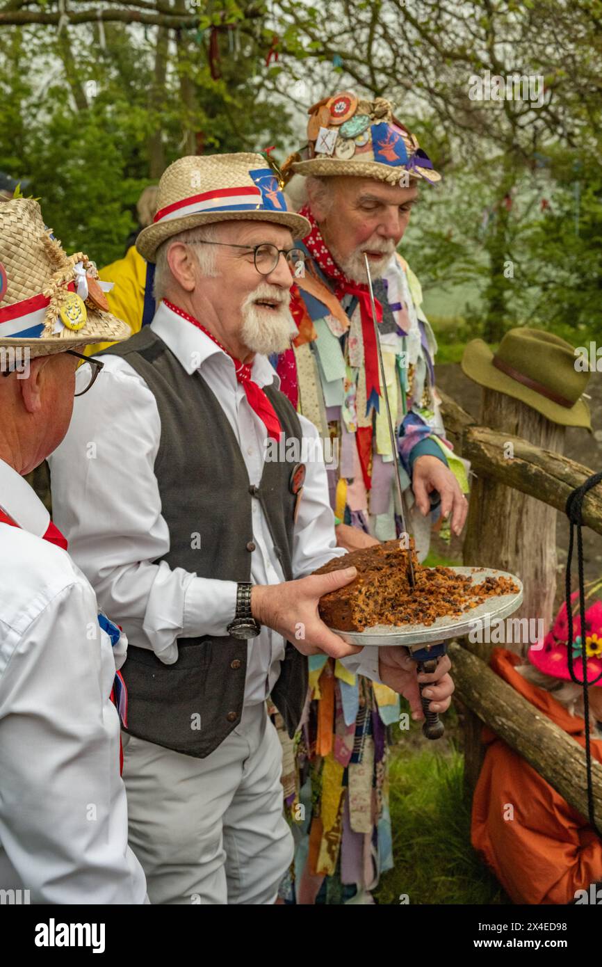 Fruit Cake being given to the audience of Morris Dancers welcoming the ...