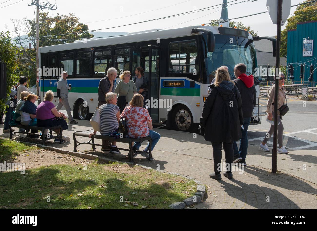 People tourists getting on and off The Island Explorer bus at a bus ...