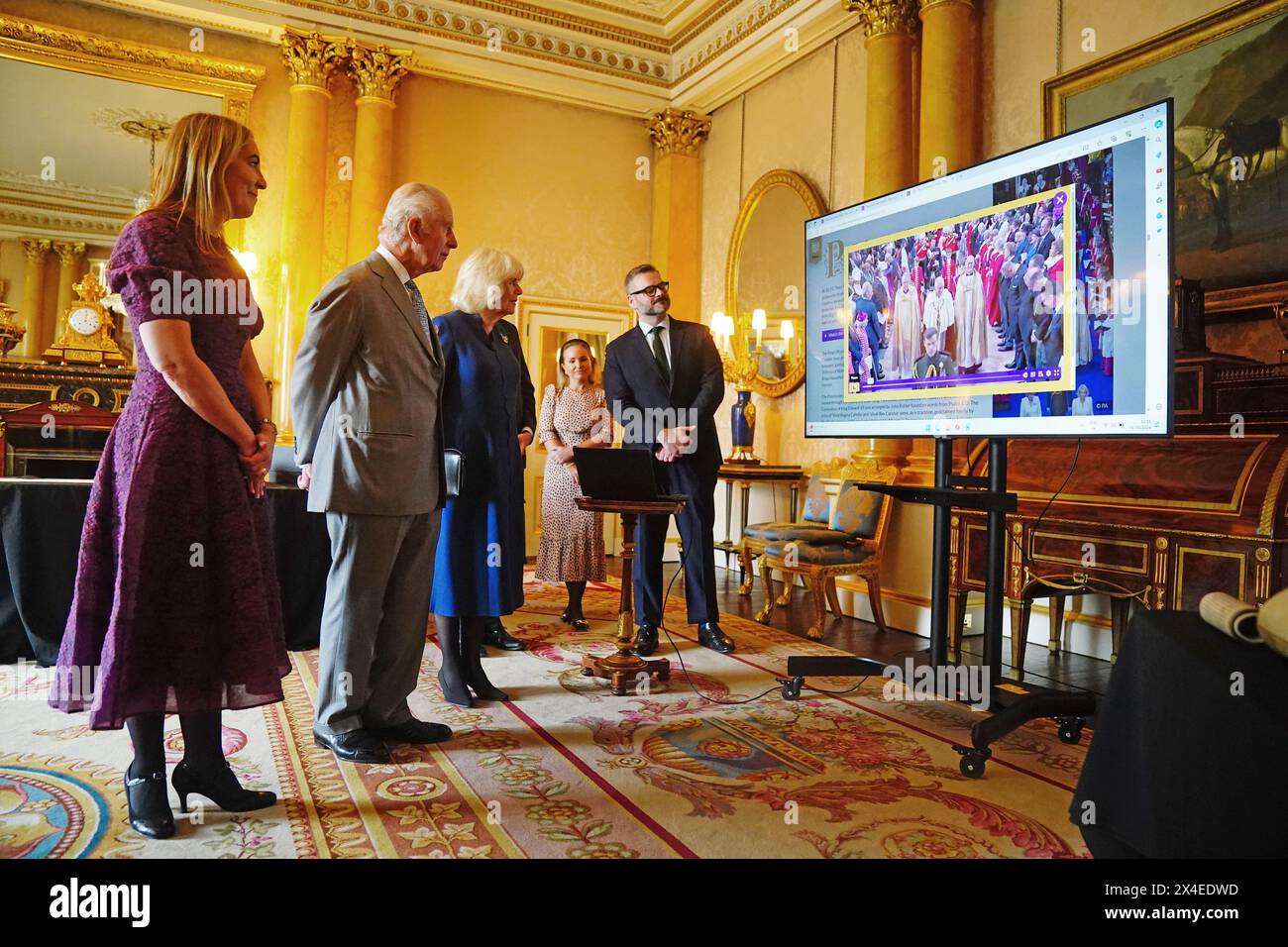 King Charles III and Queen Camilla are shown a digital version of the ...