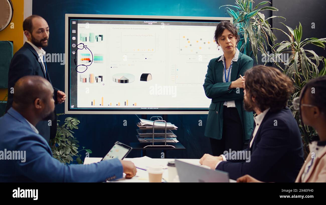 Colleagues reviewing data trends hi-res stock photography and images ...