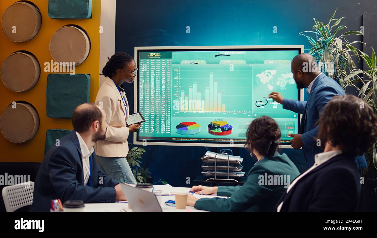 Work team assembling in a brainstorming meeting to look for sources of ...