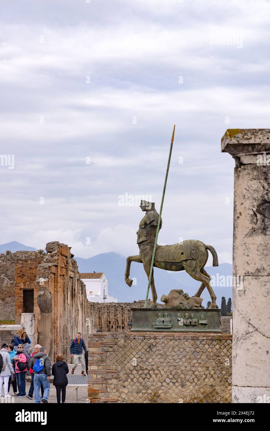 Visitors at the Centaur statue in Pompeii forum; Pompeii ruins of ancient Roman Civilization ...
