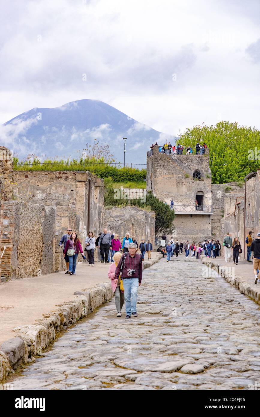Pompeii Vesuvius; People on the road with a watchtower in the walls of ...