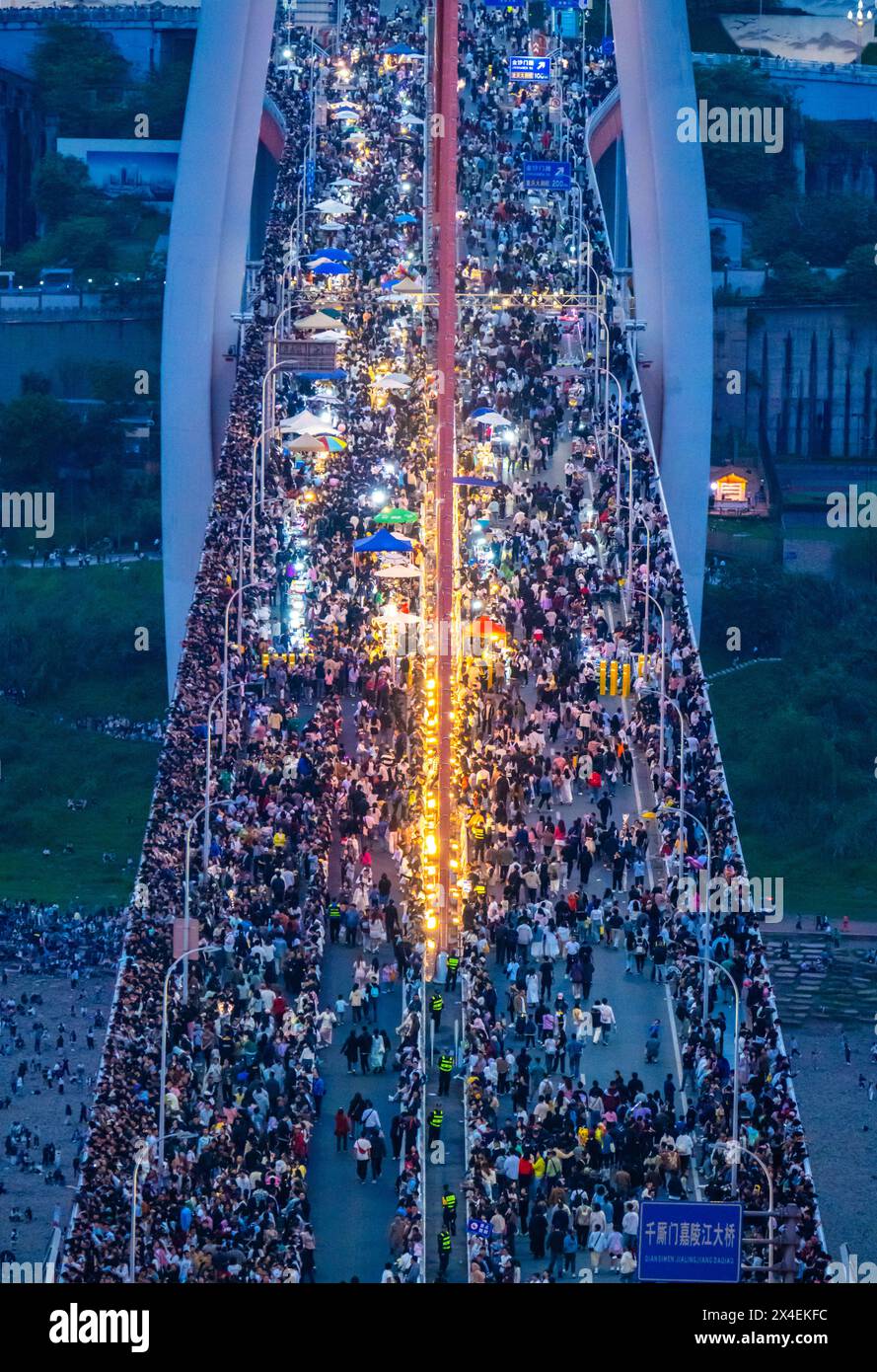 CHONGQING, CHINA - MAY 2, 2024 - Tourists visit Qiansimen Bridge during ...