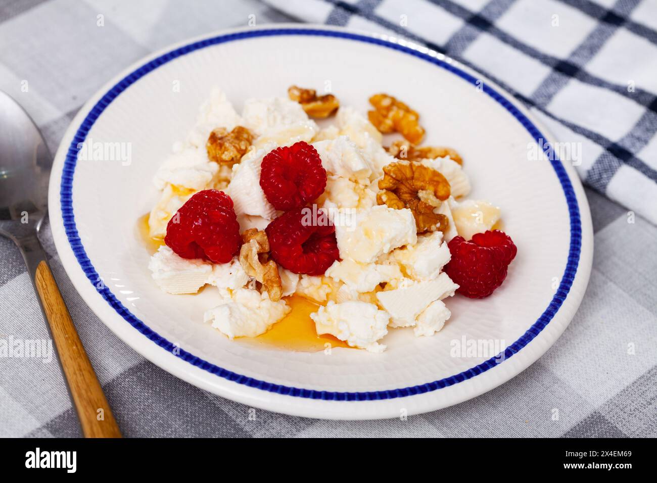 Farm cottage cheese filled with large amount of honey with walnut and ...