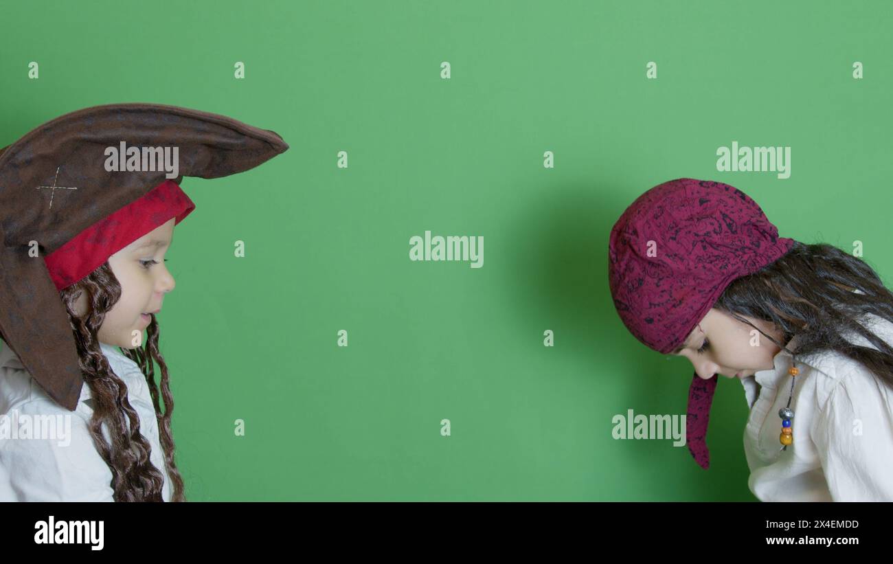 Adorable pirates, brothers in costumes making funny grimases, Isolated ...